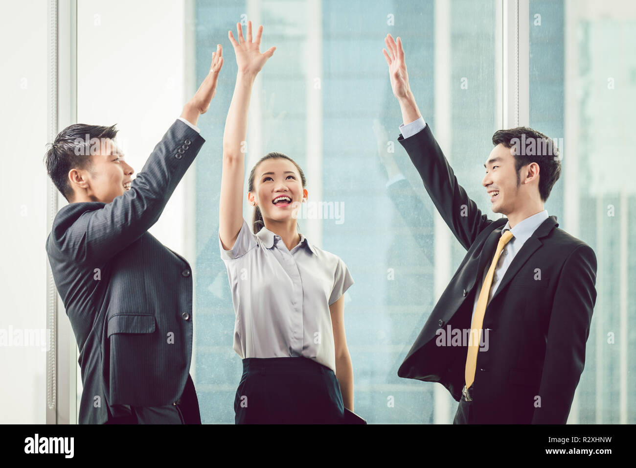 Businesswoman raising hand hi-res stock photography and images - Alamy