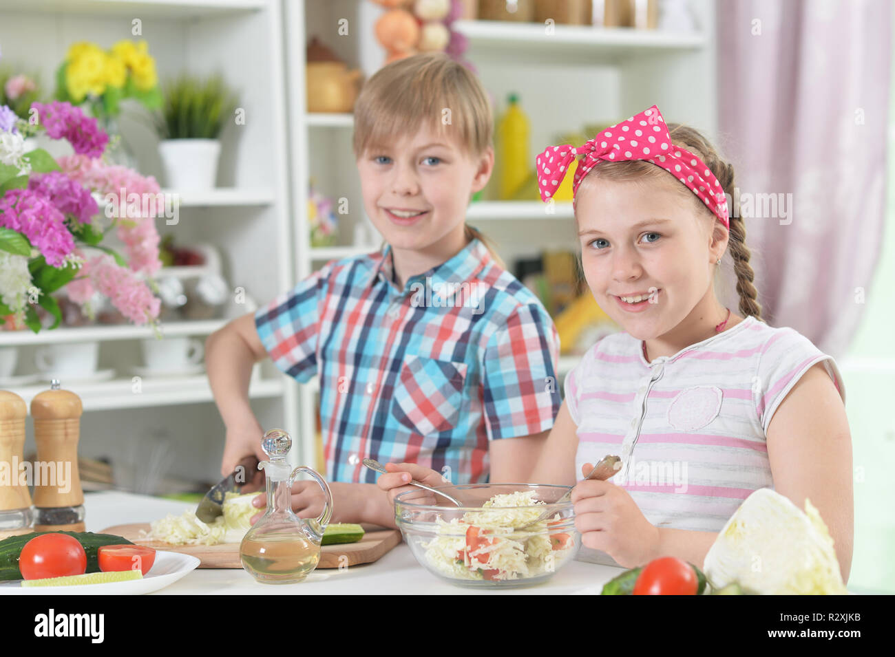 Cute brother and sister cooking together in kitchen Stock Photo - Alamy