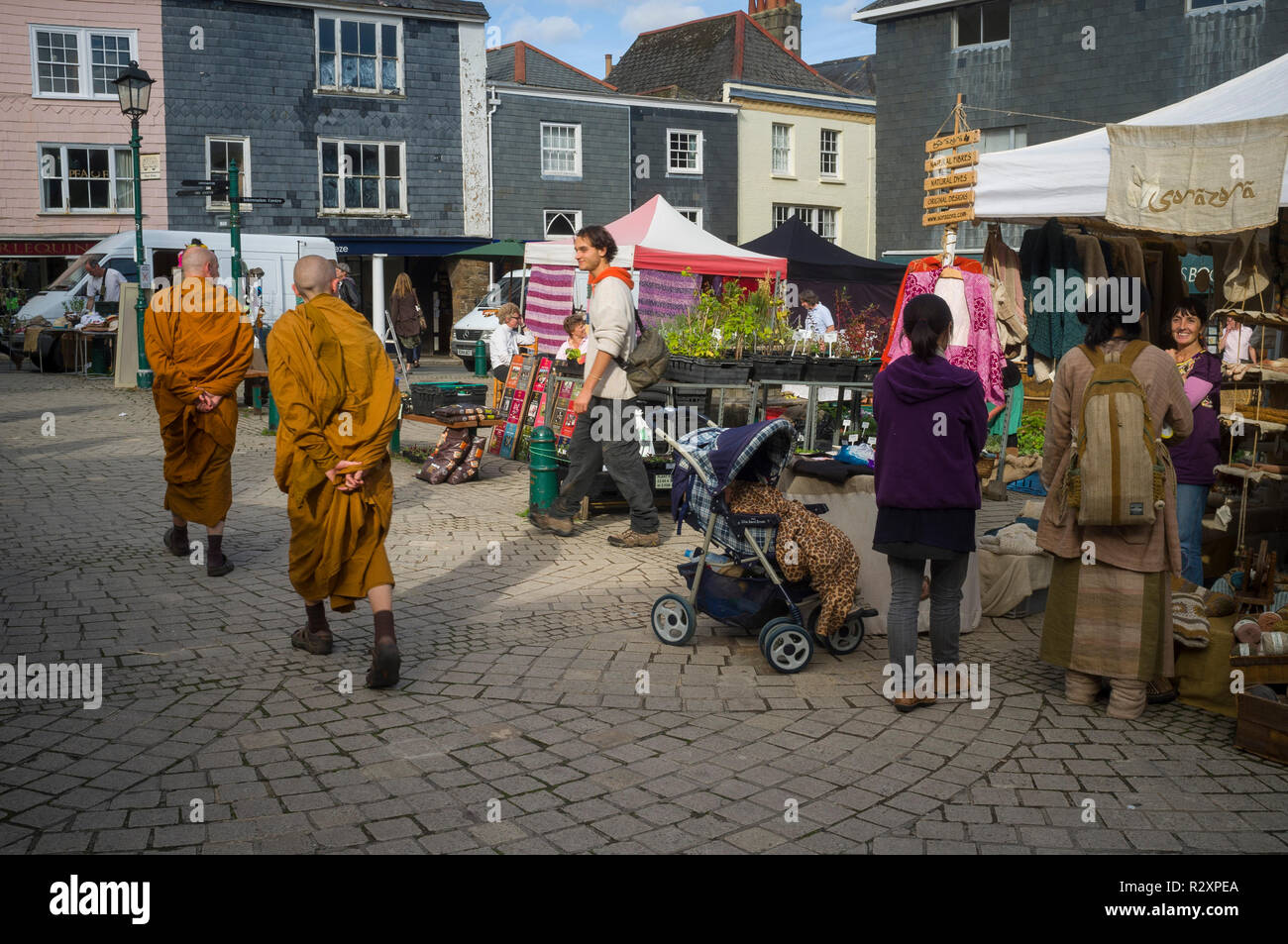 Monks pass through Totnes Market Square, Devon Stock Photo - Alamy