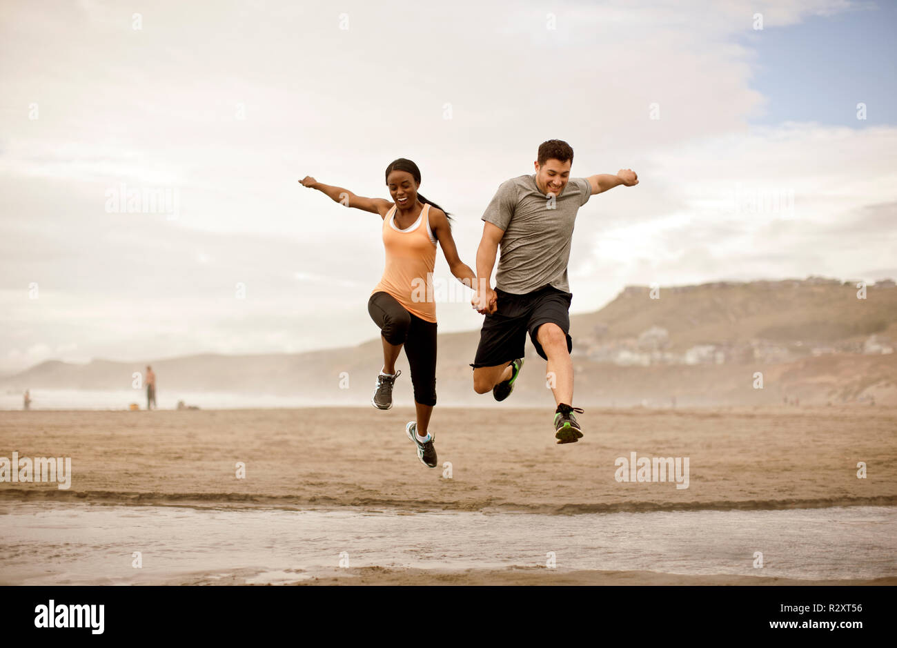 Jogging couple jumping joy hi-res stock photography and images - Alamy