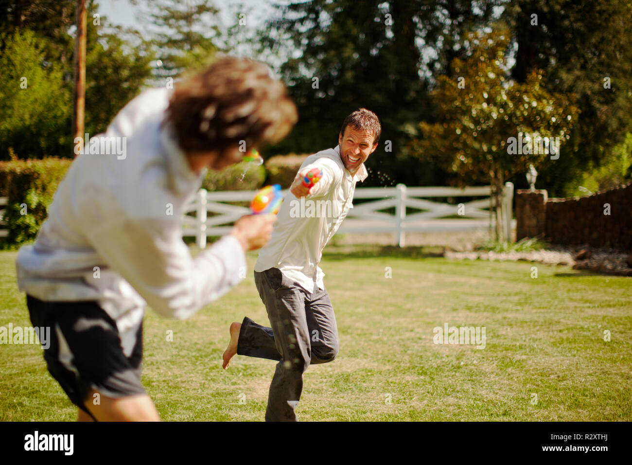Mid adult man play fighting hi-res stock photography and images - Alamy