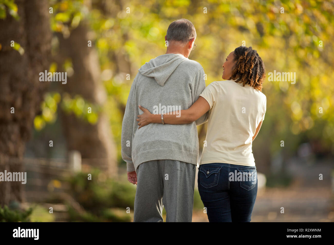 Two nurses helping patient to walk hi-res stock photography and images ...