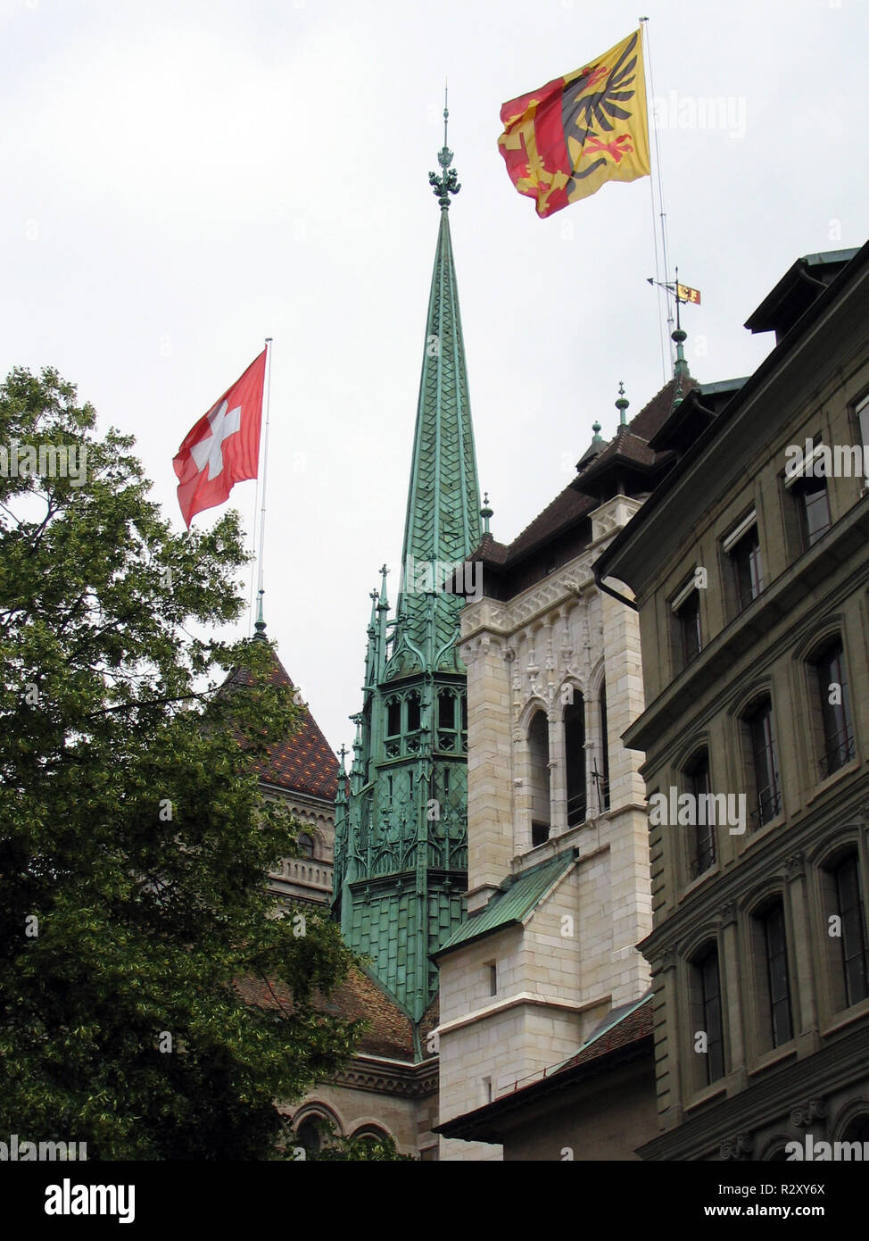 flags and church in geneva Stock Photo - Alamy