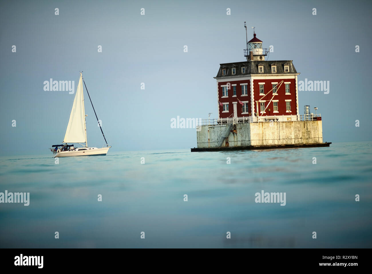 Lighthouse building surrounded by water Stock Photo - Alamy