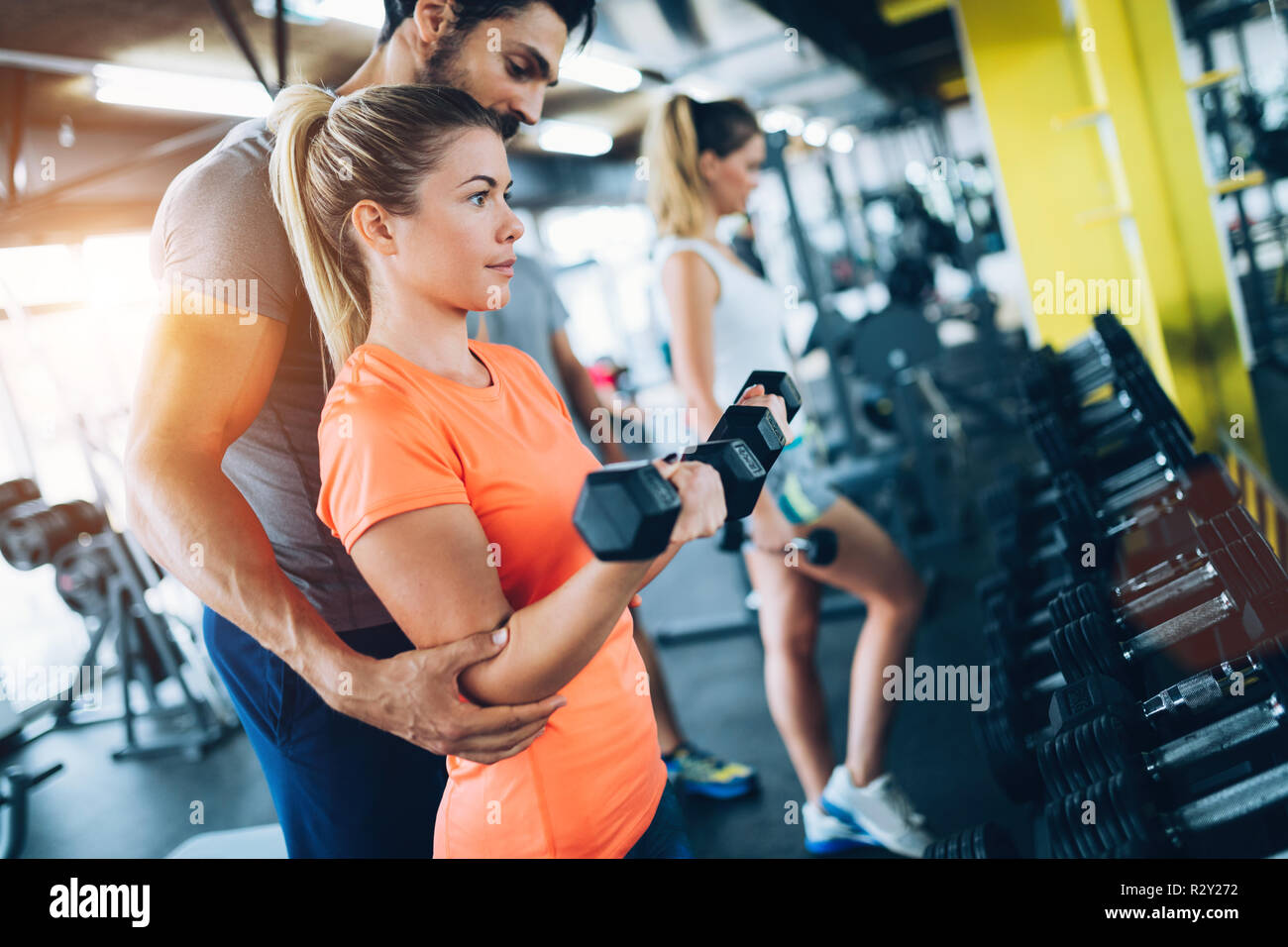 Woman exercising personal trainer gym hi-res stock photography and ...