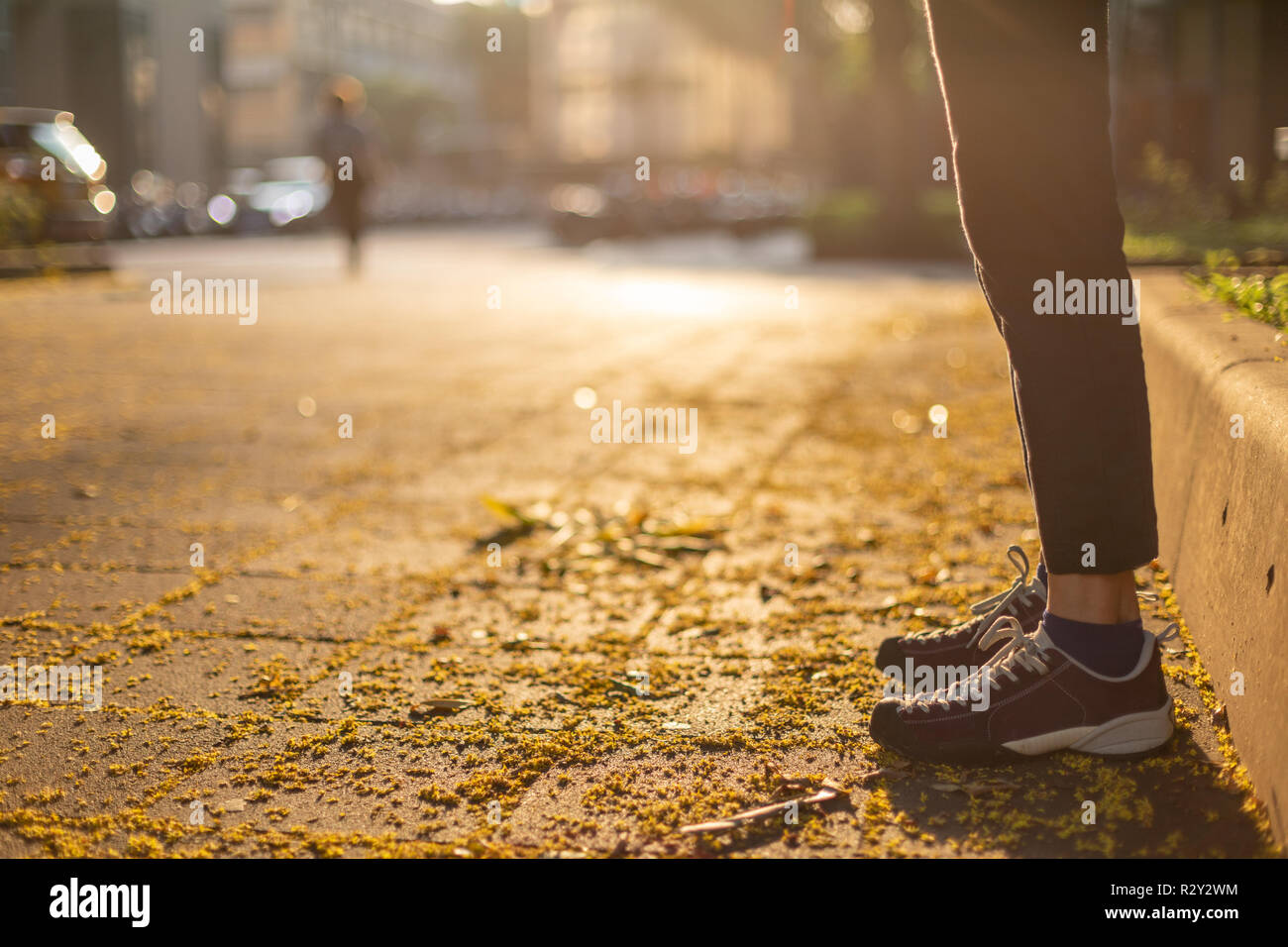 Autumn scene, woman’s legs with blurred person disappearing in the ...