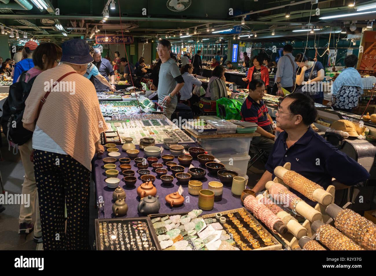 Visitors to the Jianguo Holiday Jade Market in Taipei peruse the goods ...