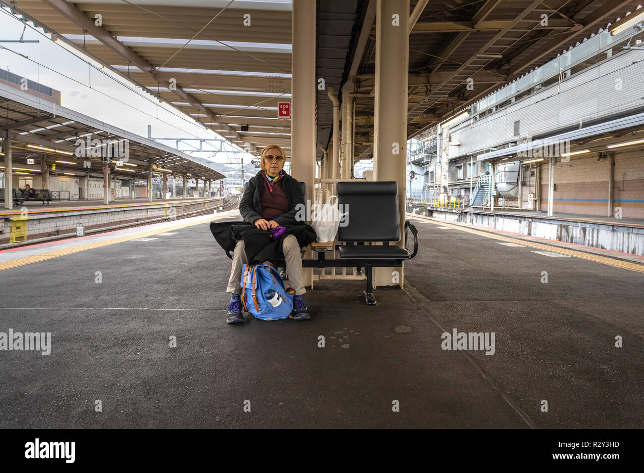 Woman waiting for the train hi-res stock photography and images - Alamy