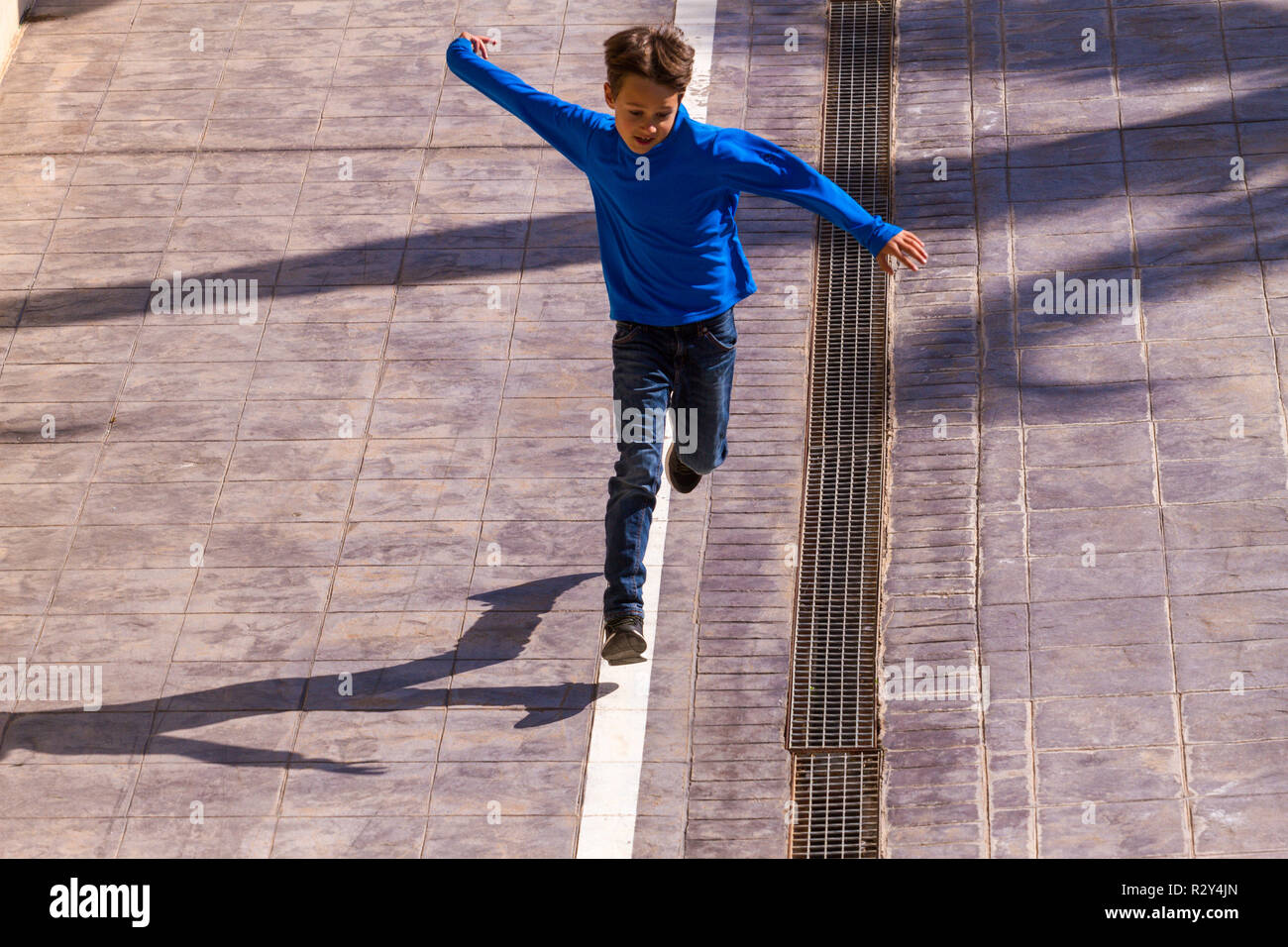 Kid jumping, running outdoor at sunny day Stock Photo - Alamy