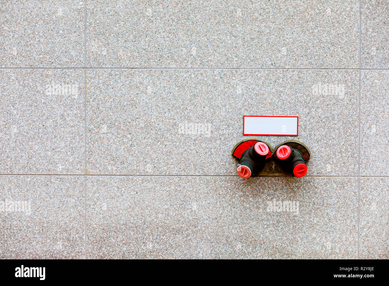 Fire hydrant on wall Stock Photo - Alamy