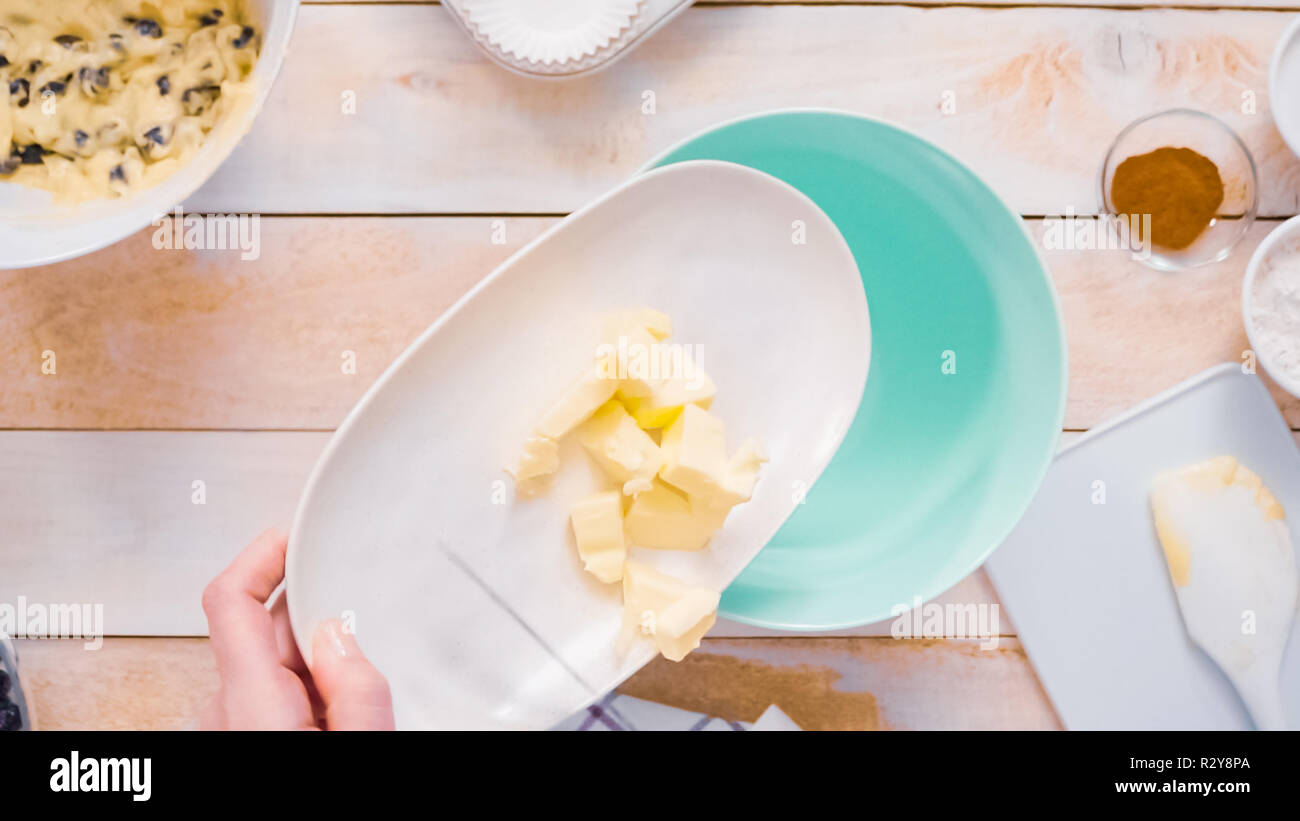 Mixing ingredients together in mixing bowl for blueberry muffins Stock ...