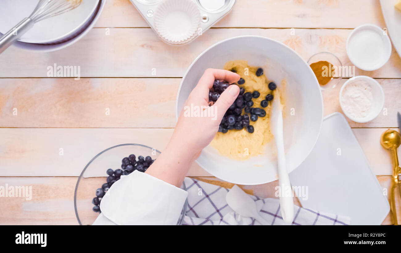 Mixing ingredients together in mixing bowl for blueberry muffins Stock ...