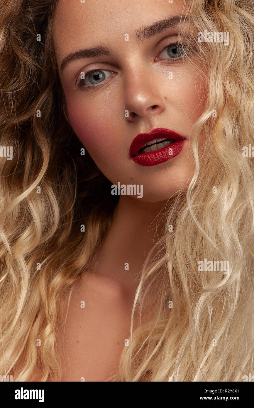 studio beauty headshot of a young girl with red lips Stock Photo - Alamy