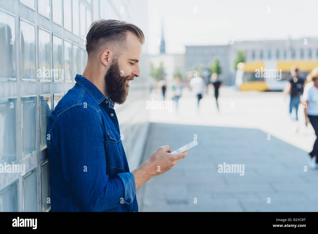 Using a mobile in a public space hi-res stock photography and images ...
