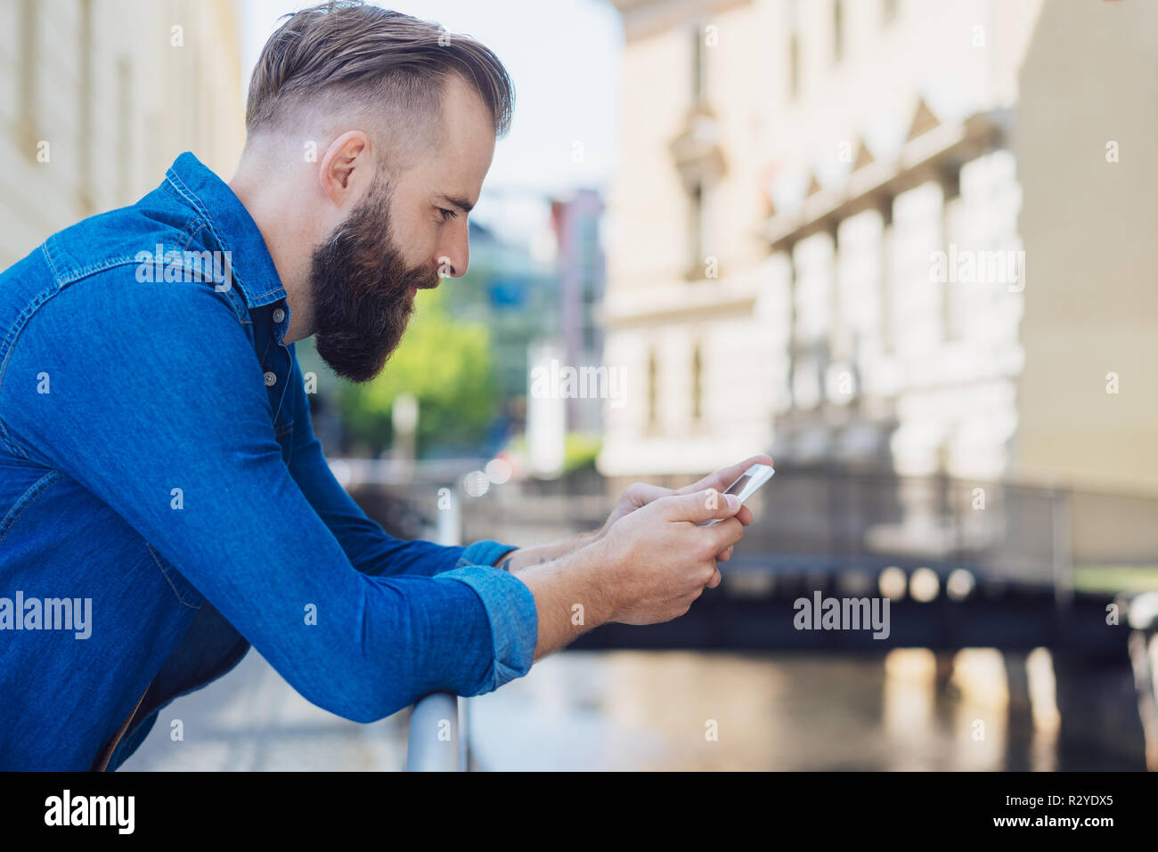 Man leaning over railing hi-res stock photography and images - Alamy