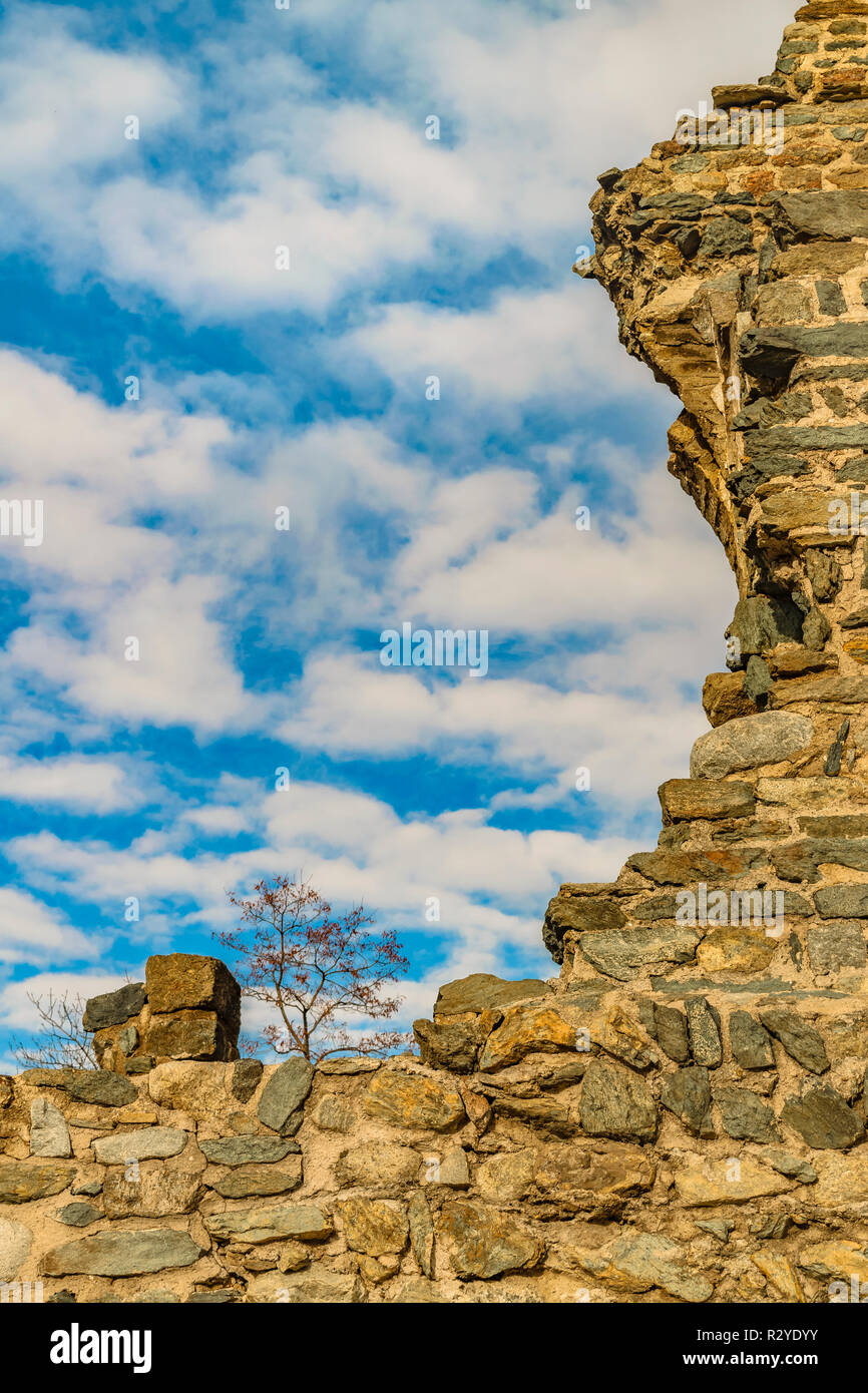 Exterior view of antique broken stone material building located at ...