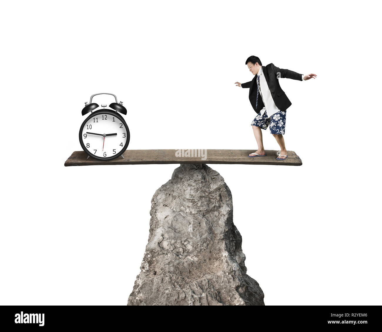Man balancing against alarm clock at hilltop isolated in white ...
