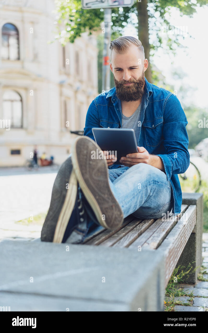 Feet up on bench hi-res stock photography and images - Alamy