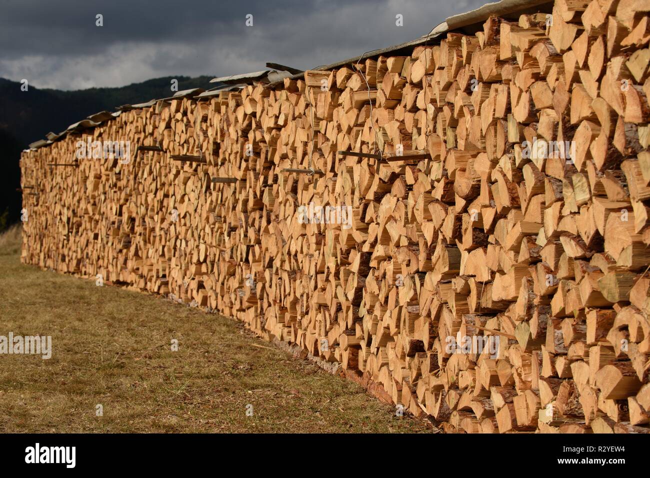 Cut wood on a pile ready for burning Stock Photo - Alamy