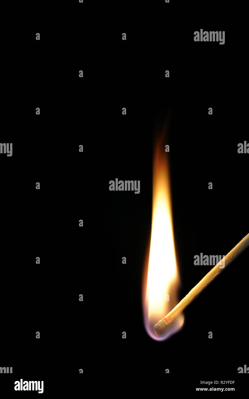 match flame on black background Stock Photo - Alamy