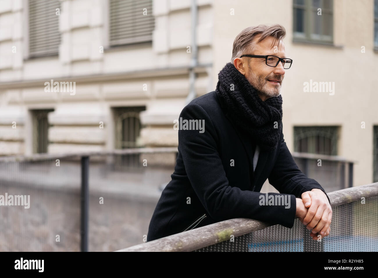 Man leaning over railing hi-res stock photography and images - Alamy