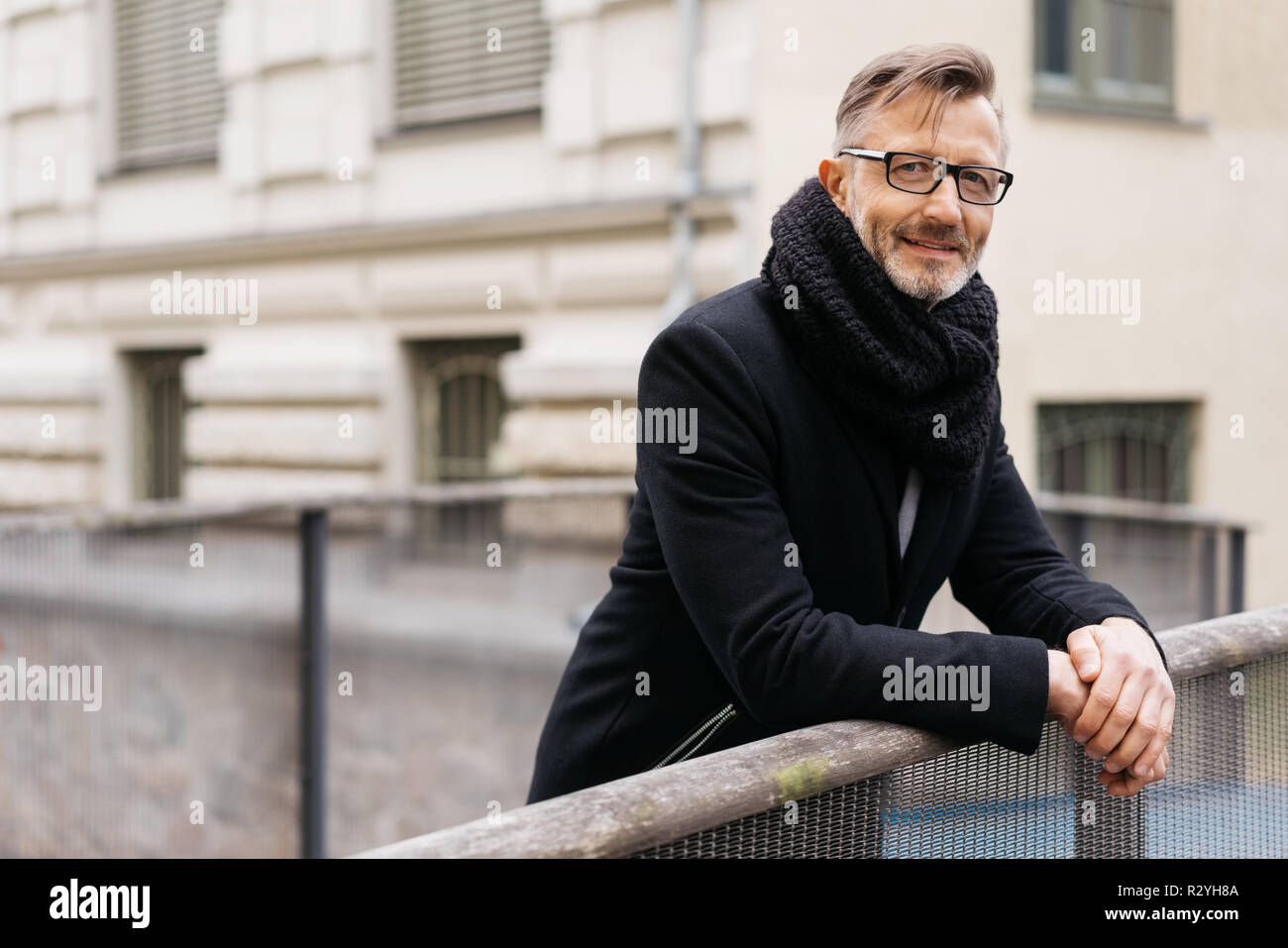 Man leaning on bridge railing hi-res stock photography and images - Alamy