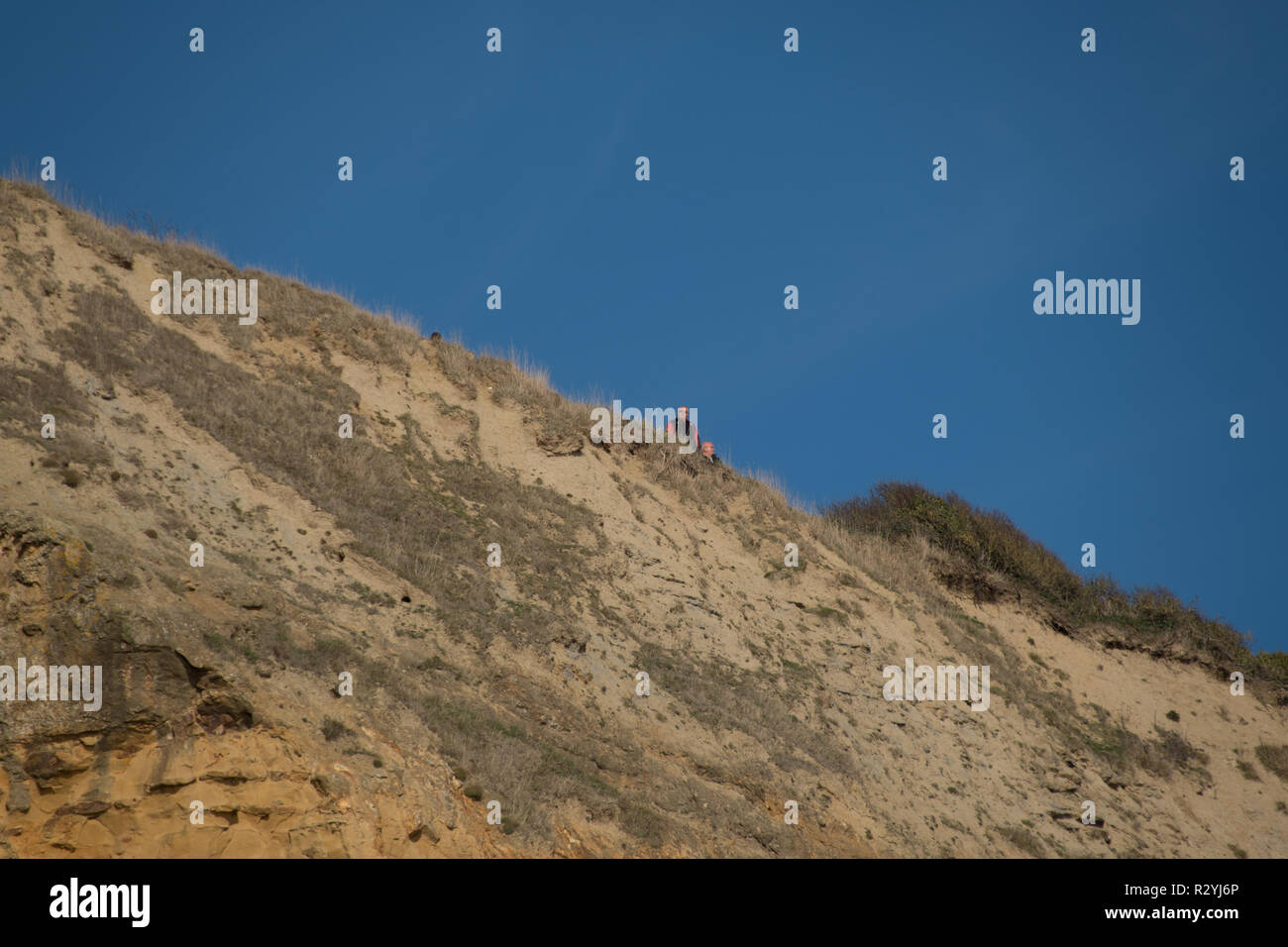 tourists on the edges of unstable cliffs Stock Photo - Alamy