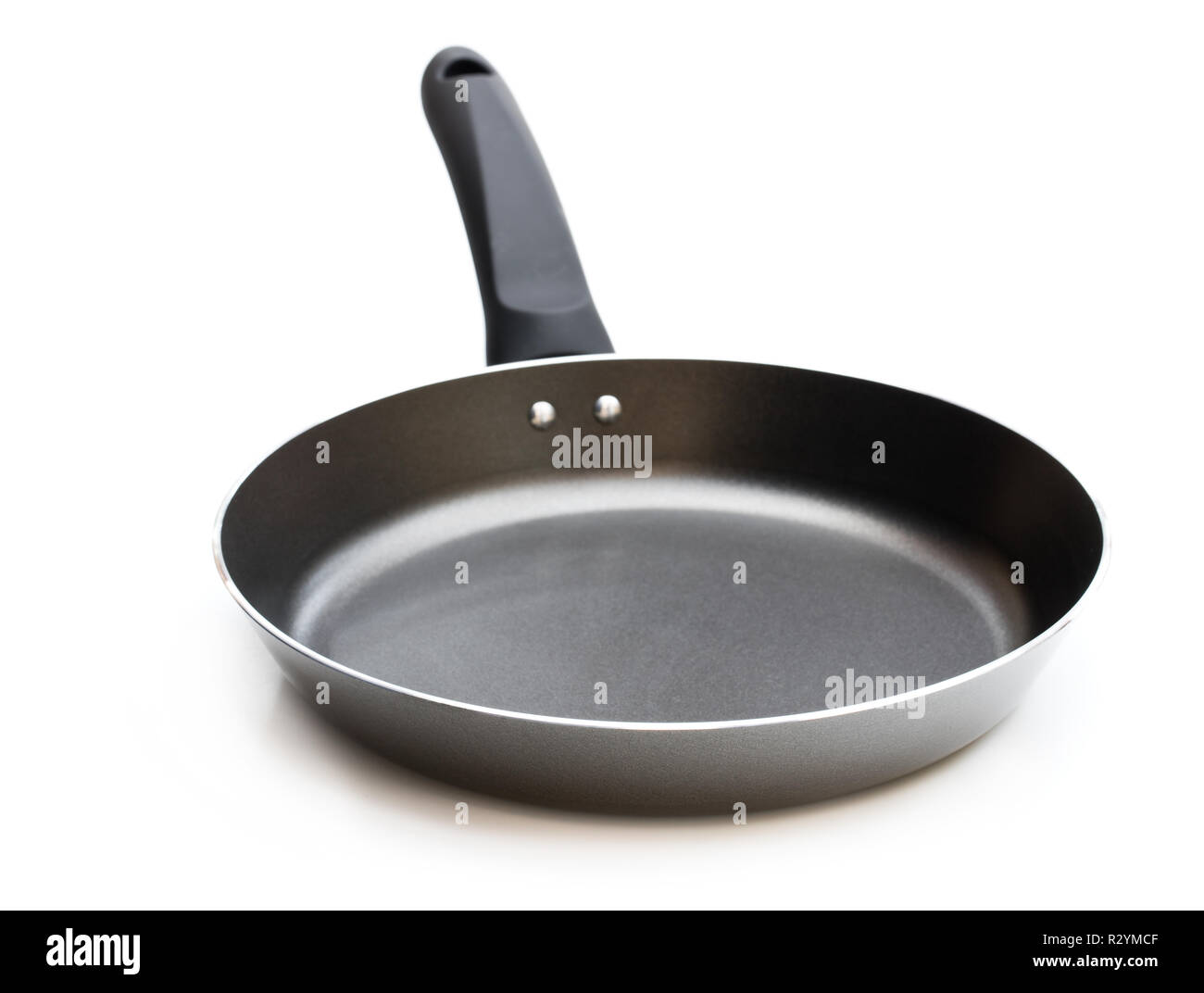 New frying pan isolated on white Stock Photo - Alamy