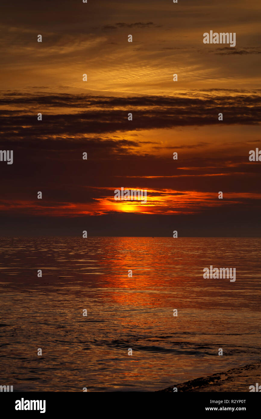 Sunset reflection on the sea Stock Photo - Alamy
