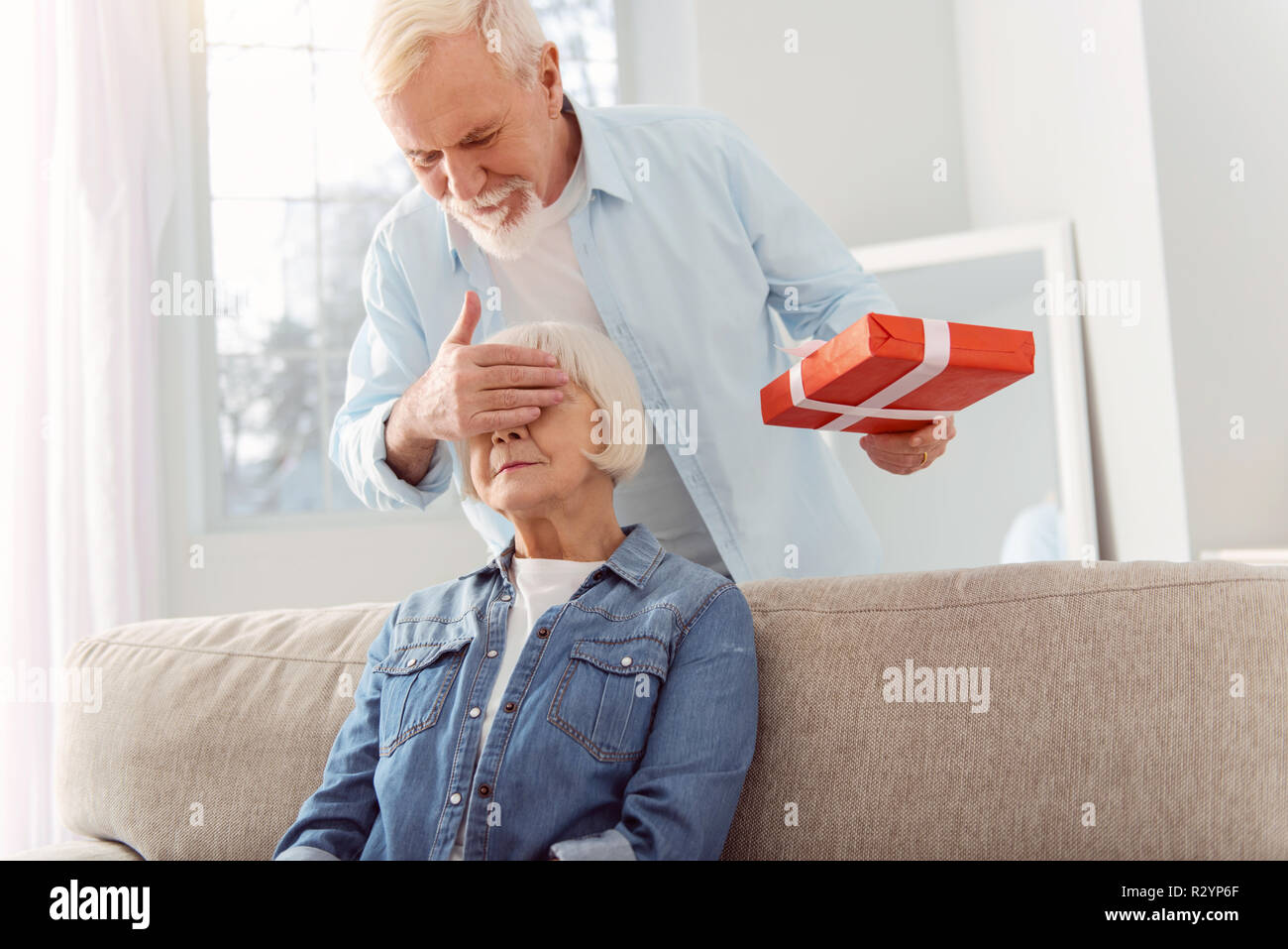 Mature woman receiving gift from hi-res stock photography and images ...