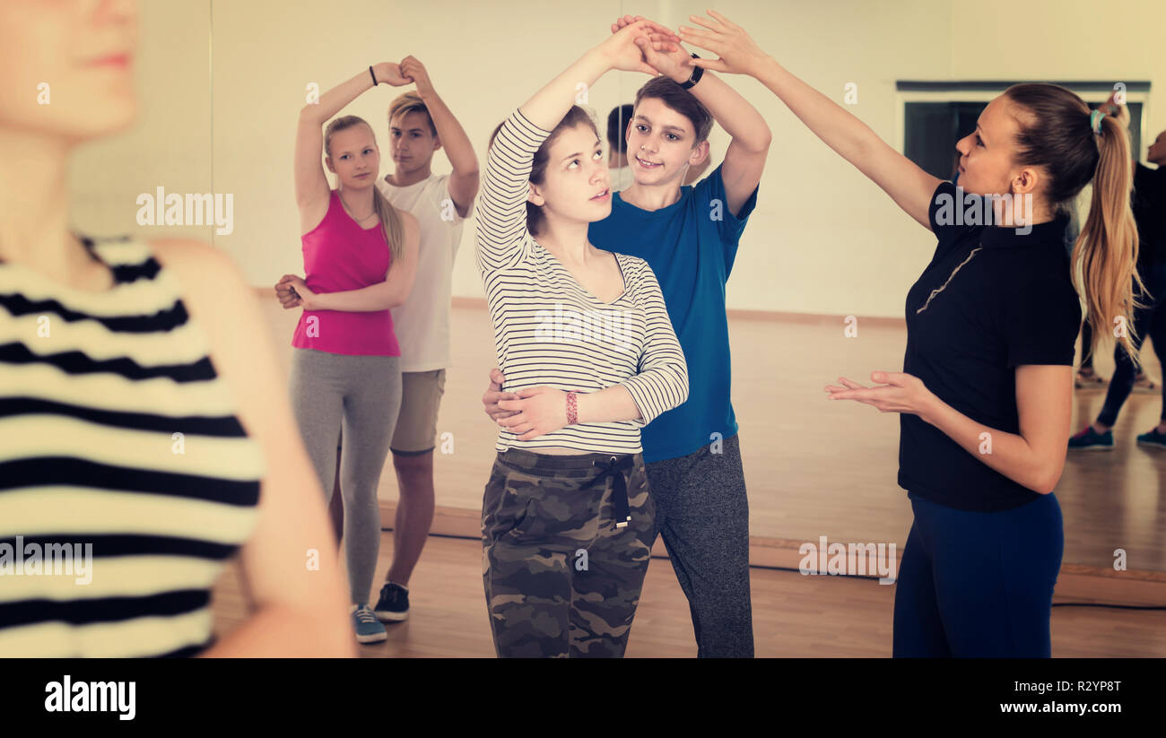 Group of positive spanish teen dancing salsa in dance studio Stock ...