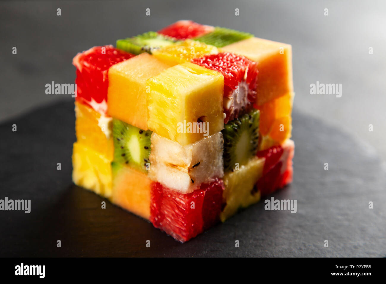 Fruit cube isolated on white background Stock Photo - Alamy