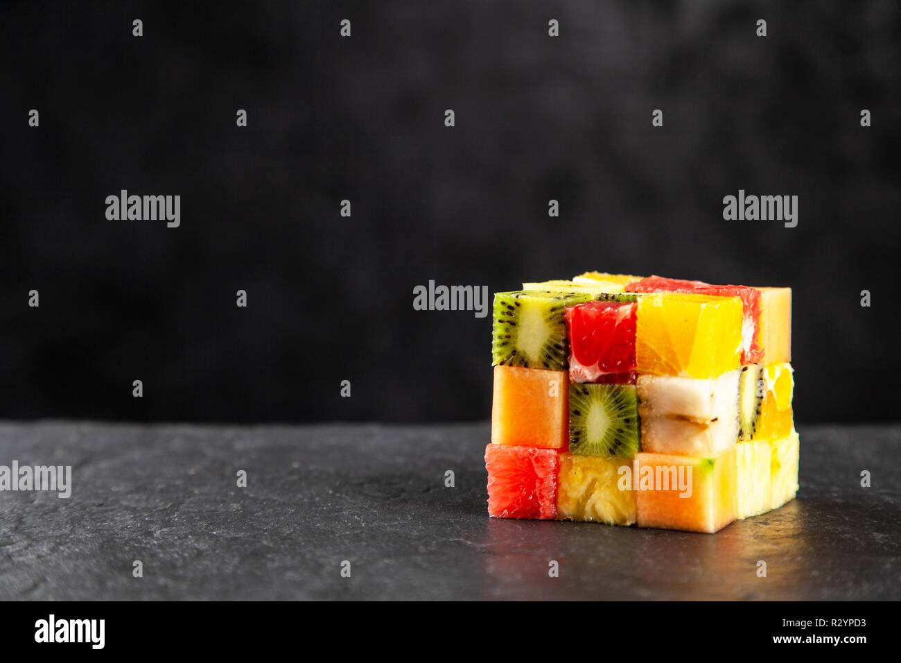 Fruit cube isolated on white background Stock Photo - Alamy