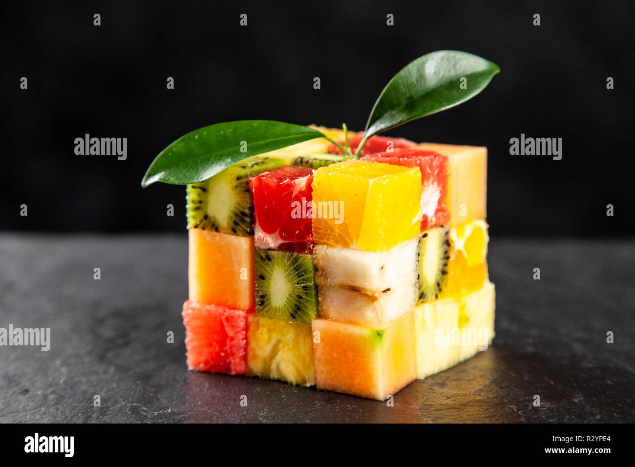 Fruit cube isolated on white background Stock Photo - Alamy