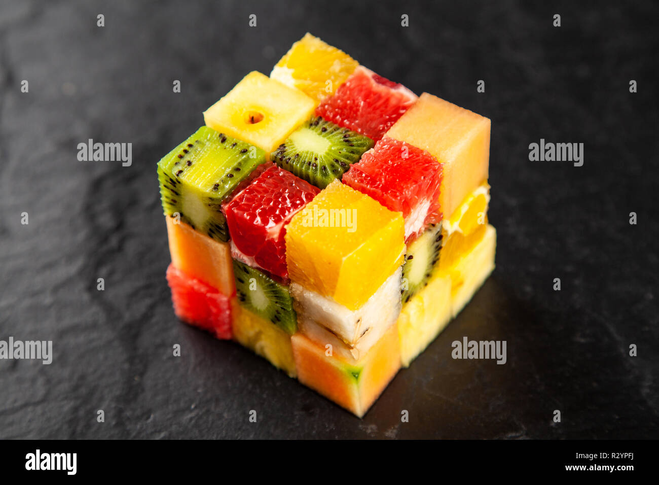 Fruit cube isolated on white background Stock Photo - Alamy
