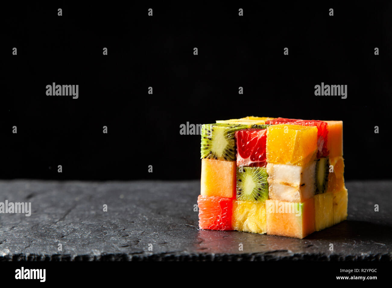 Fruit cube isolated on white background Stock Photo - Alamy