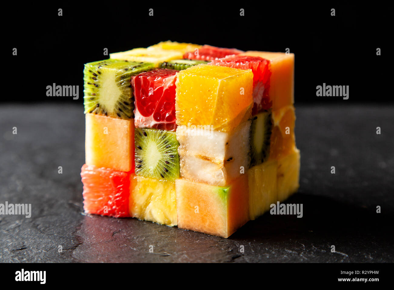 Fruit cube isolated on white background Stock Photo - Alamy