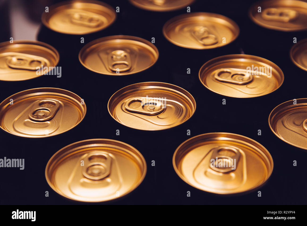 metal beer cans background black Stock Photo - Alamy