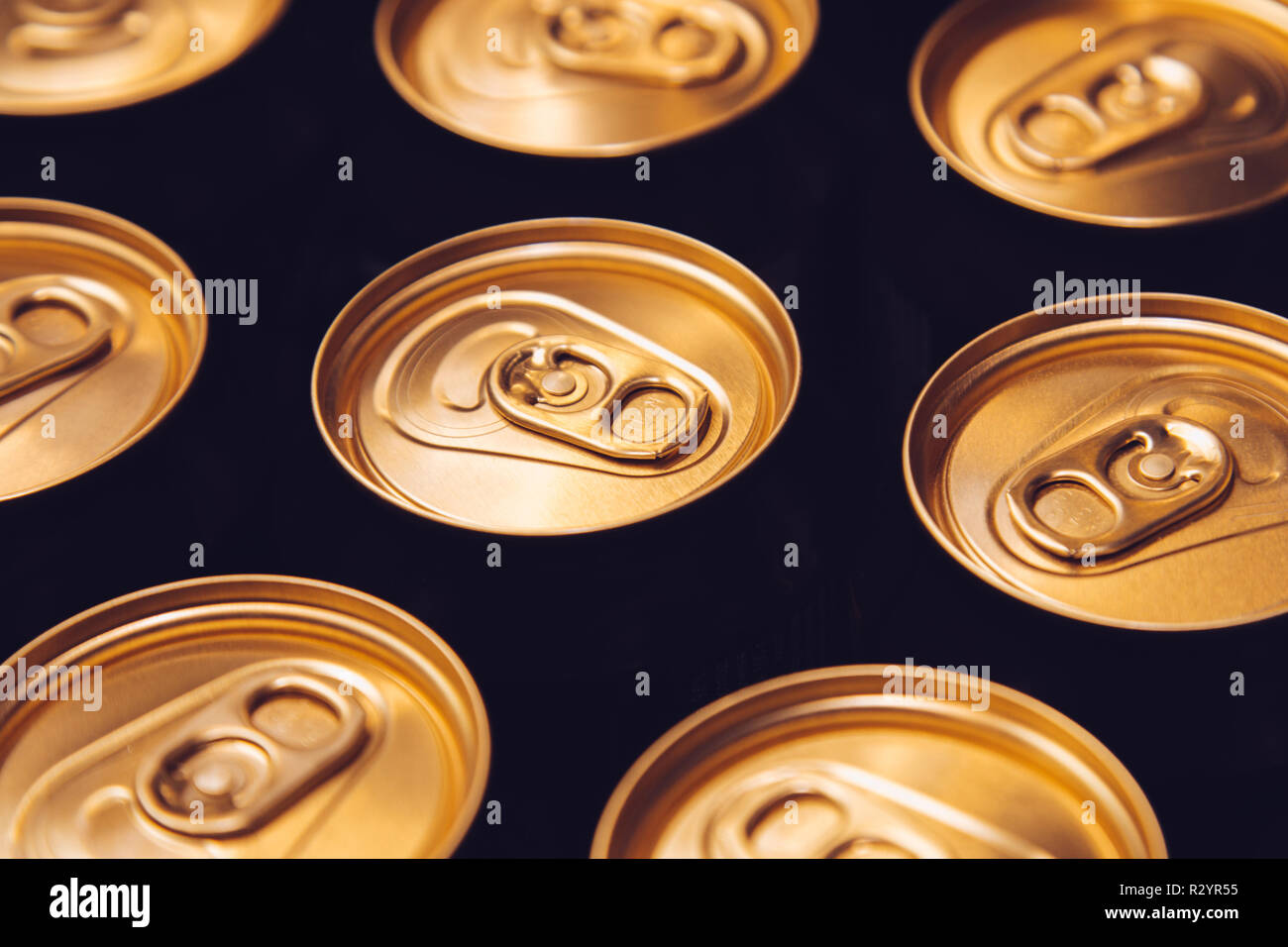 metal beer cans background black Stock Photo - Alamy