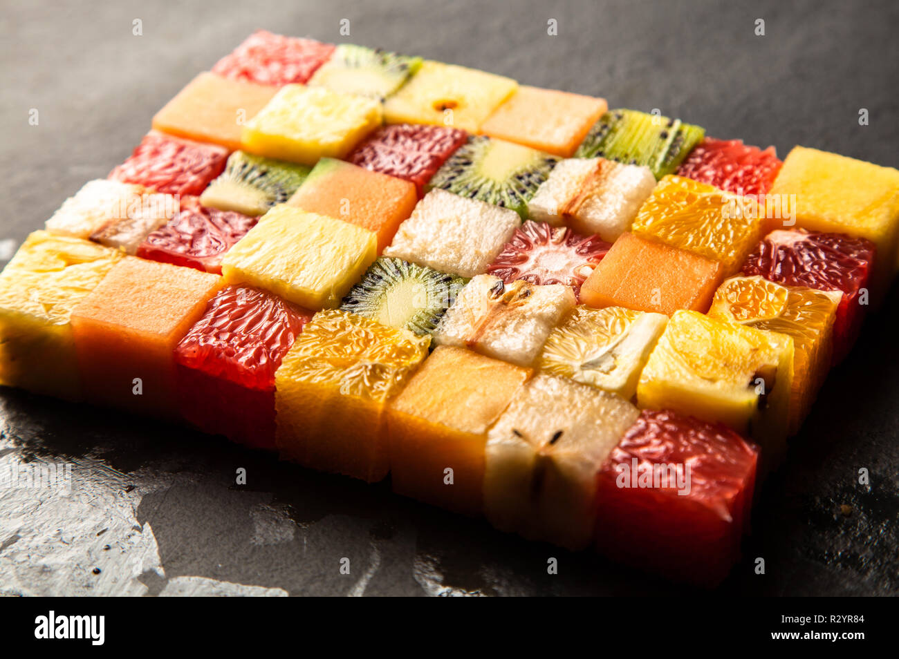 Fruit cube isolated on white background Stock Photo - Alamy