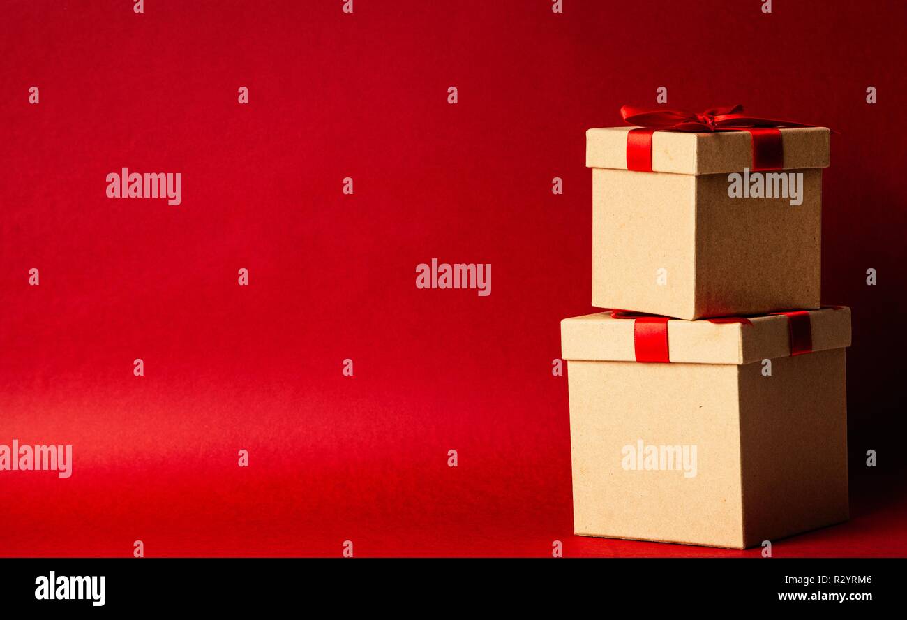 Gift boxes on red background Stock Photo - Alamy