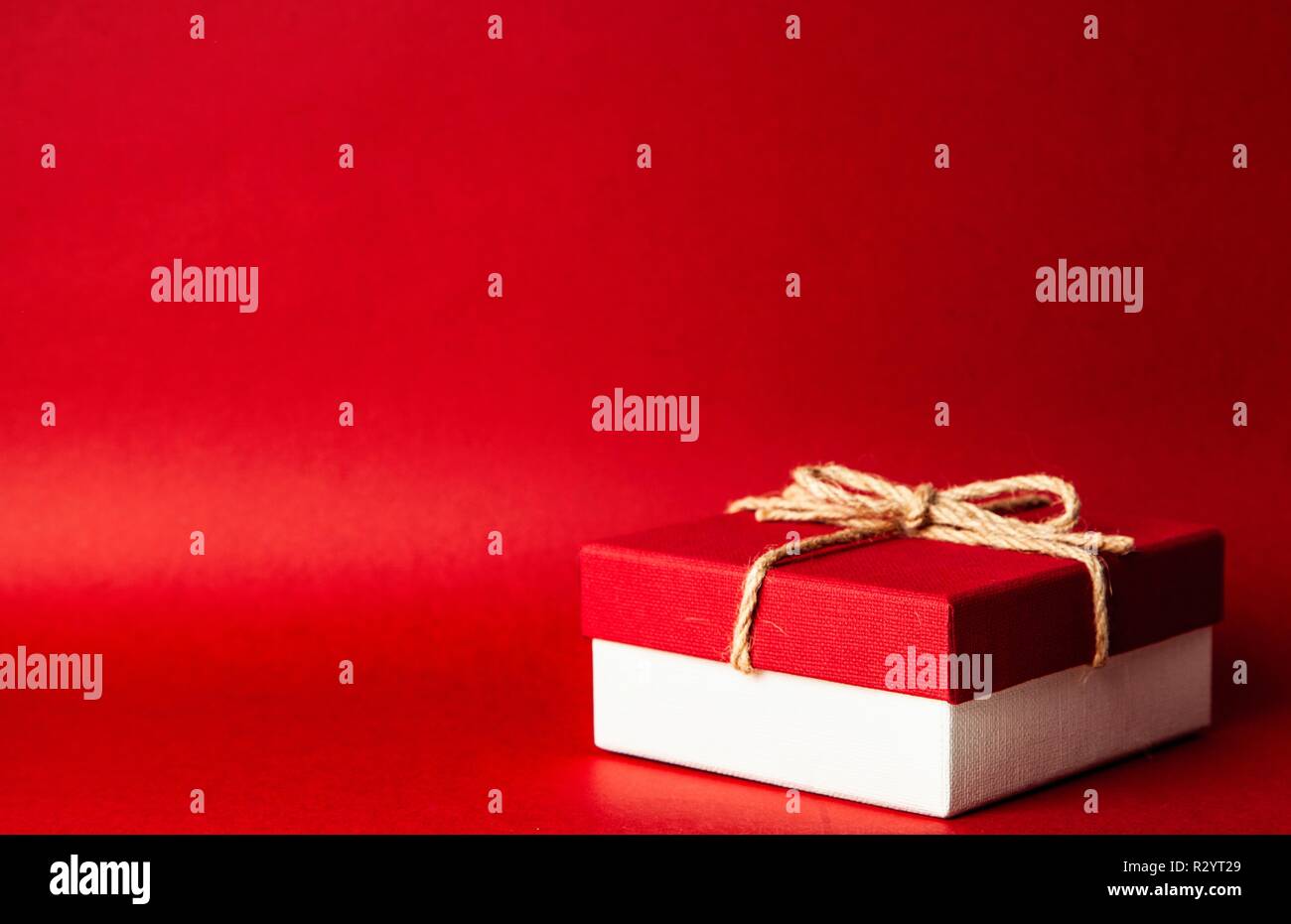 Gift boxes on red background Stock Photo - Alamy