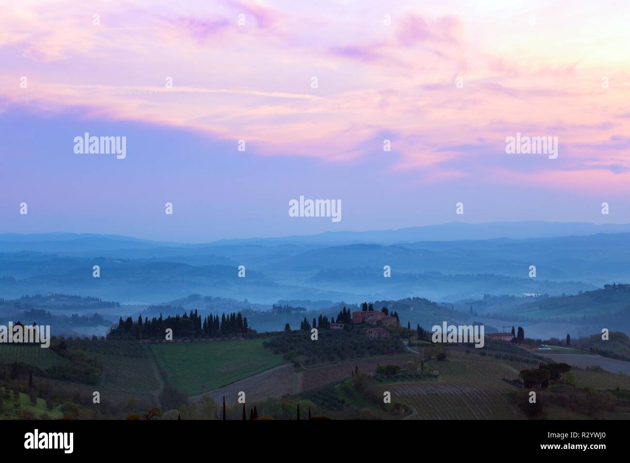 dawn - foggy morning at the Toscana with the rising sun beams. Tuscany ...
