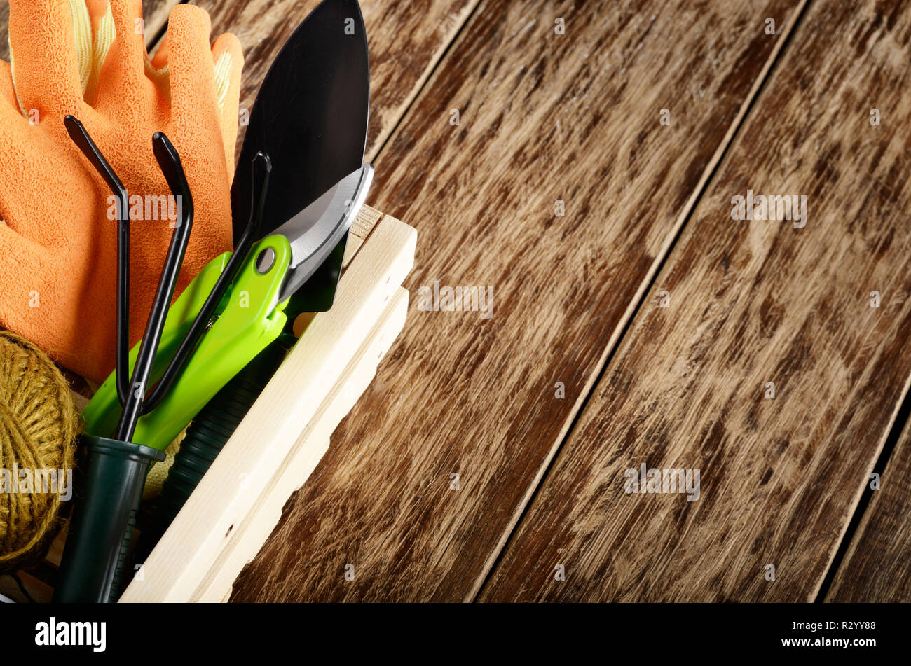 Gardening tools of rake shovel wire cutter and gloves Stock Photo - Alamy