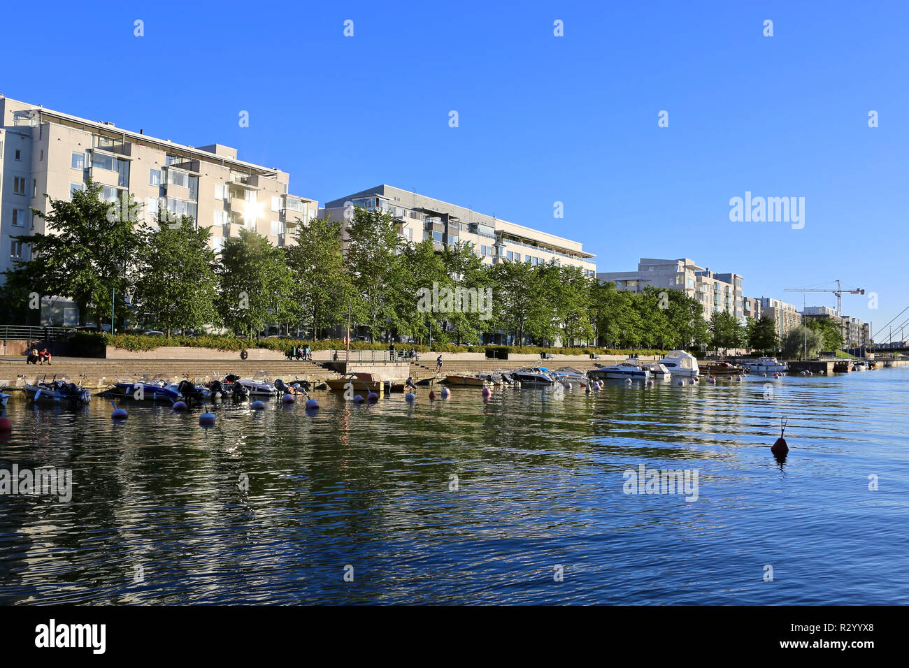 Houses, boats and line of trees next to canal of Ruoholahti, the green ...