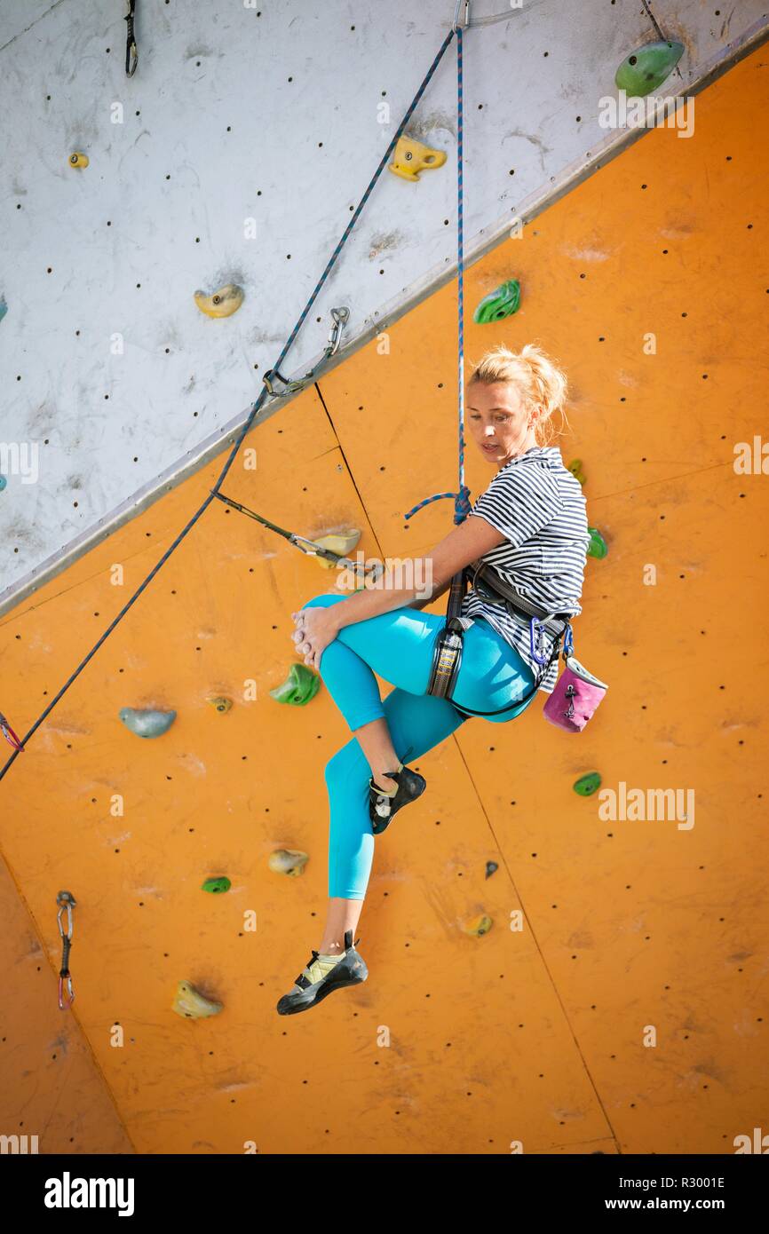 bouldering, girl climbing up the wall Stock Photo - Alamy