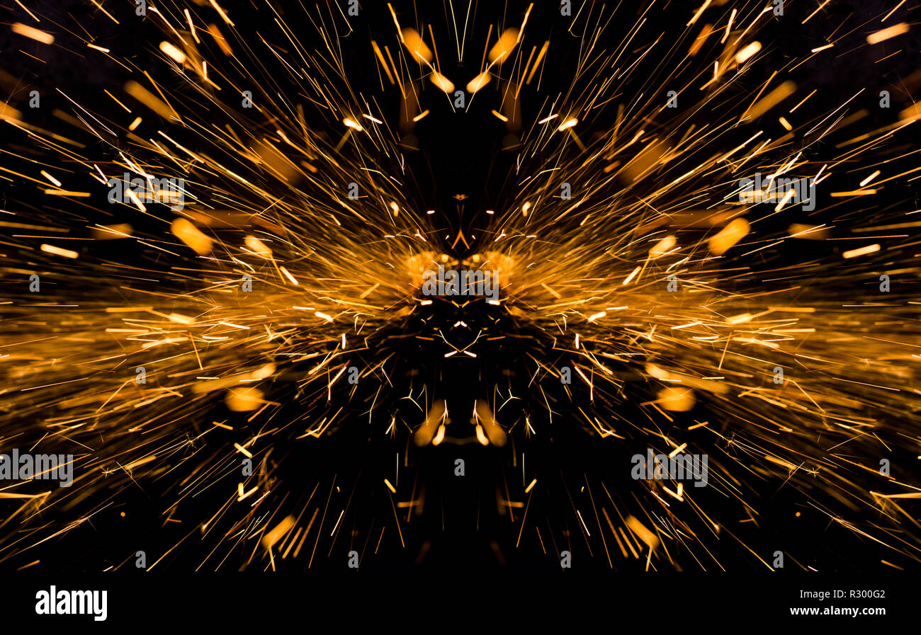 Bright yellow sparks on a black background Stock Photo - Alamy