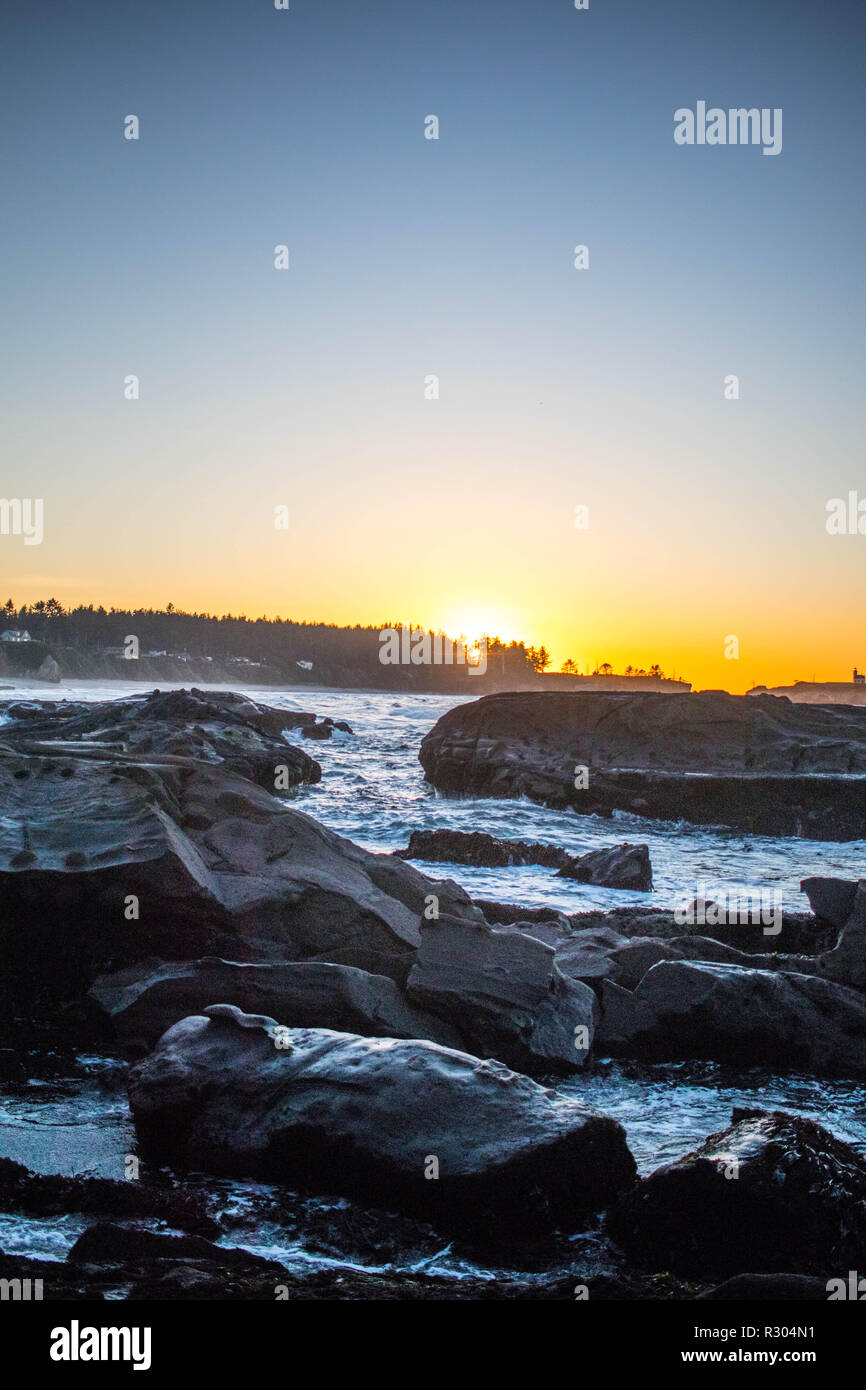Sunset Bay State Park lives up to it's name as the setting sun casts a ...