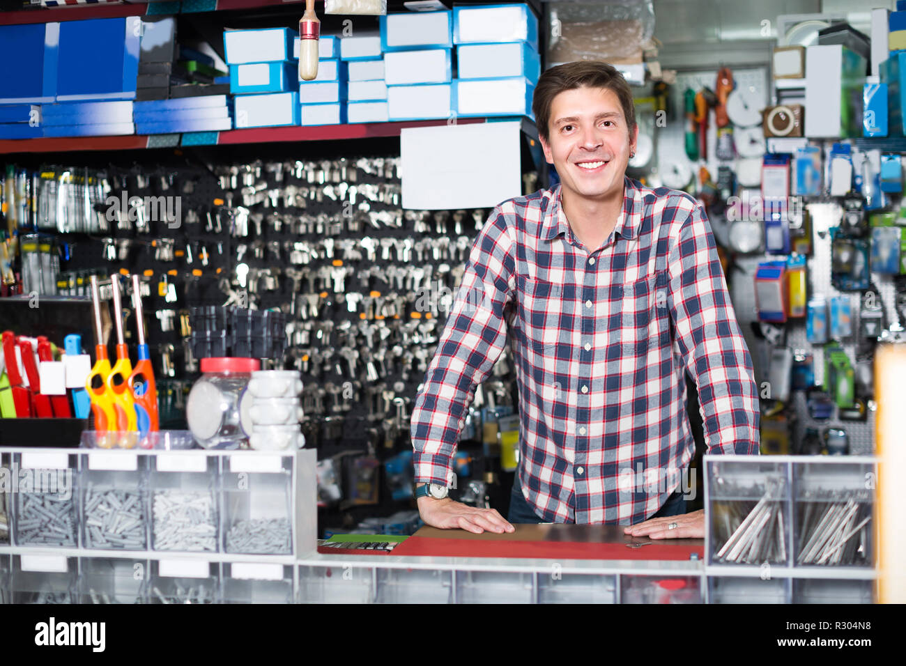 Portrait of employee which is selling nails in harware store Stock ...