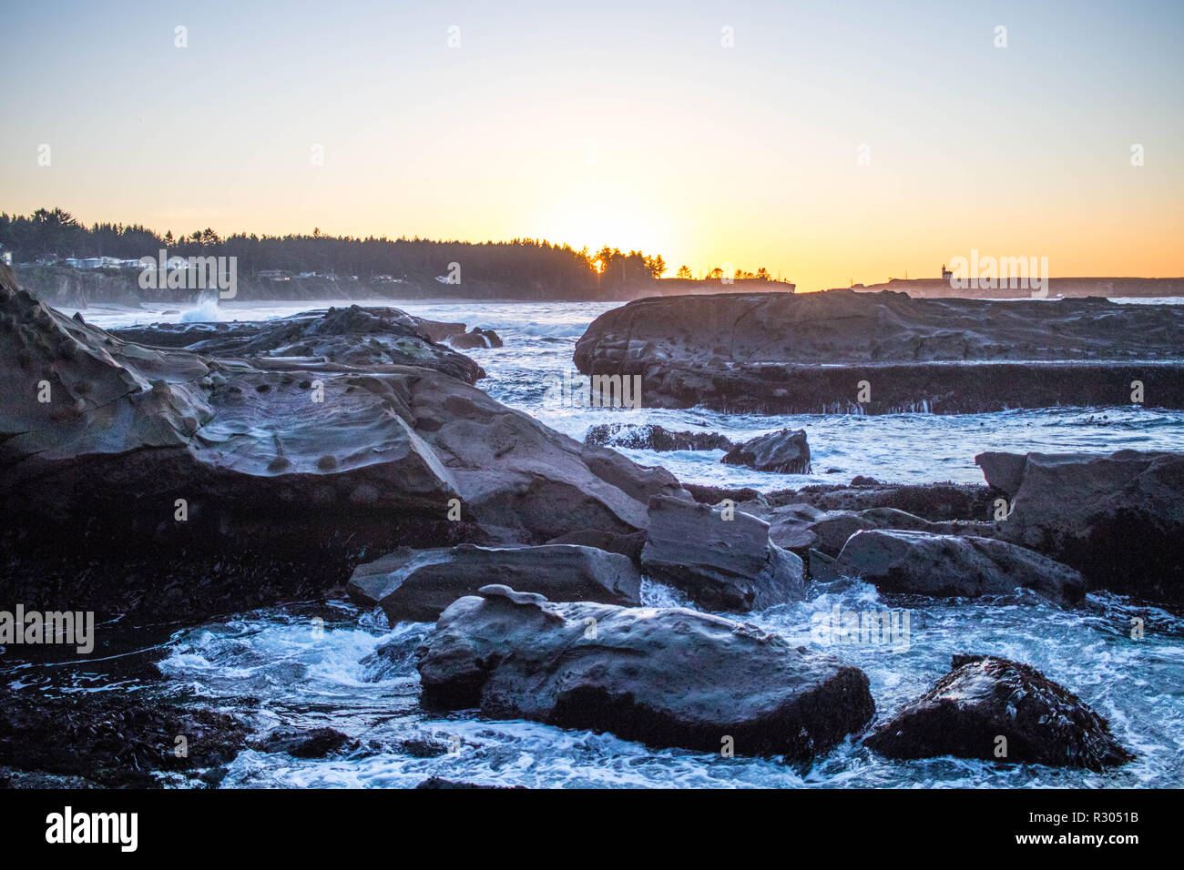 Sunset Bay State Park lives up to it's name as the setting sun casts a ...